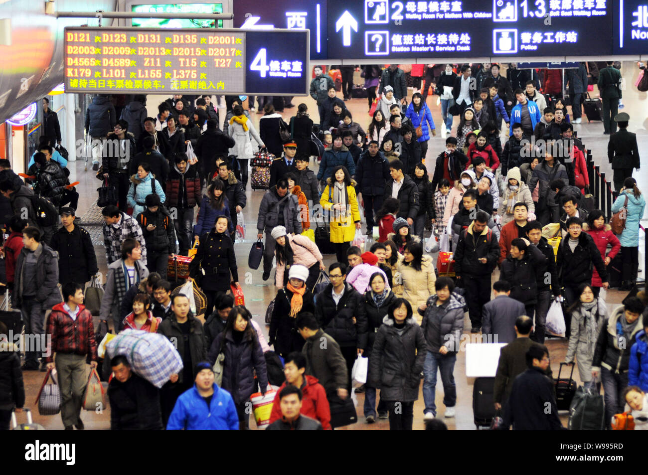 Chinese passengers crowd the Beijing West Railway Station during the ...