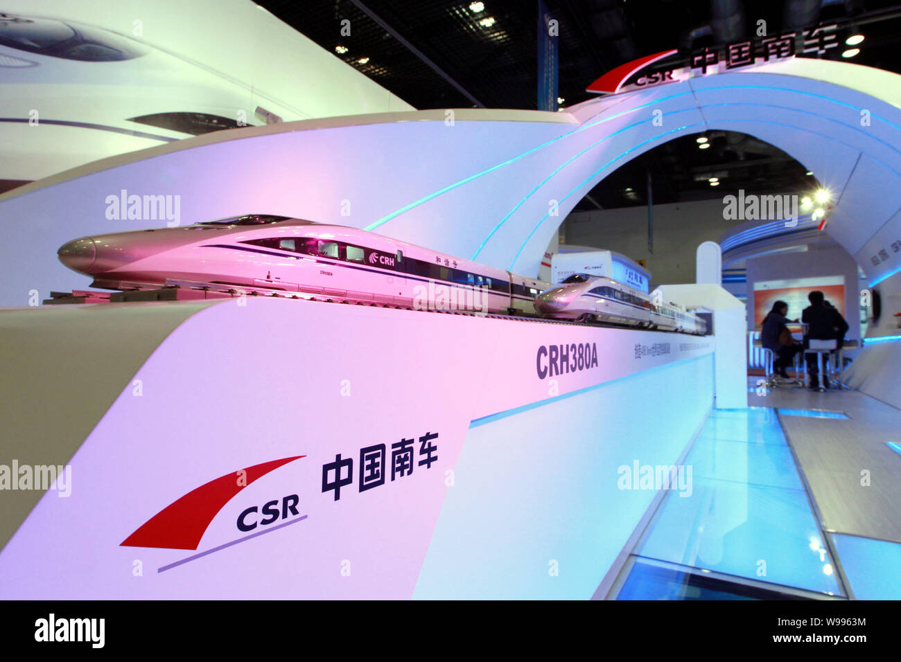 Models of the CRH380A high-speed trains are displayed at the stand of ...