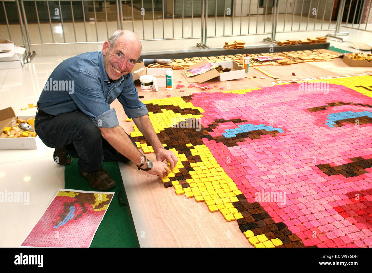 Maurice Bennett of New Zealand, known as Toast Art Picasso, works on ...