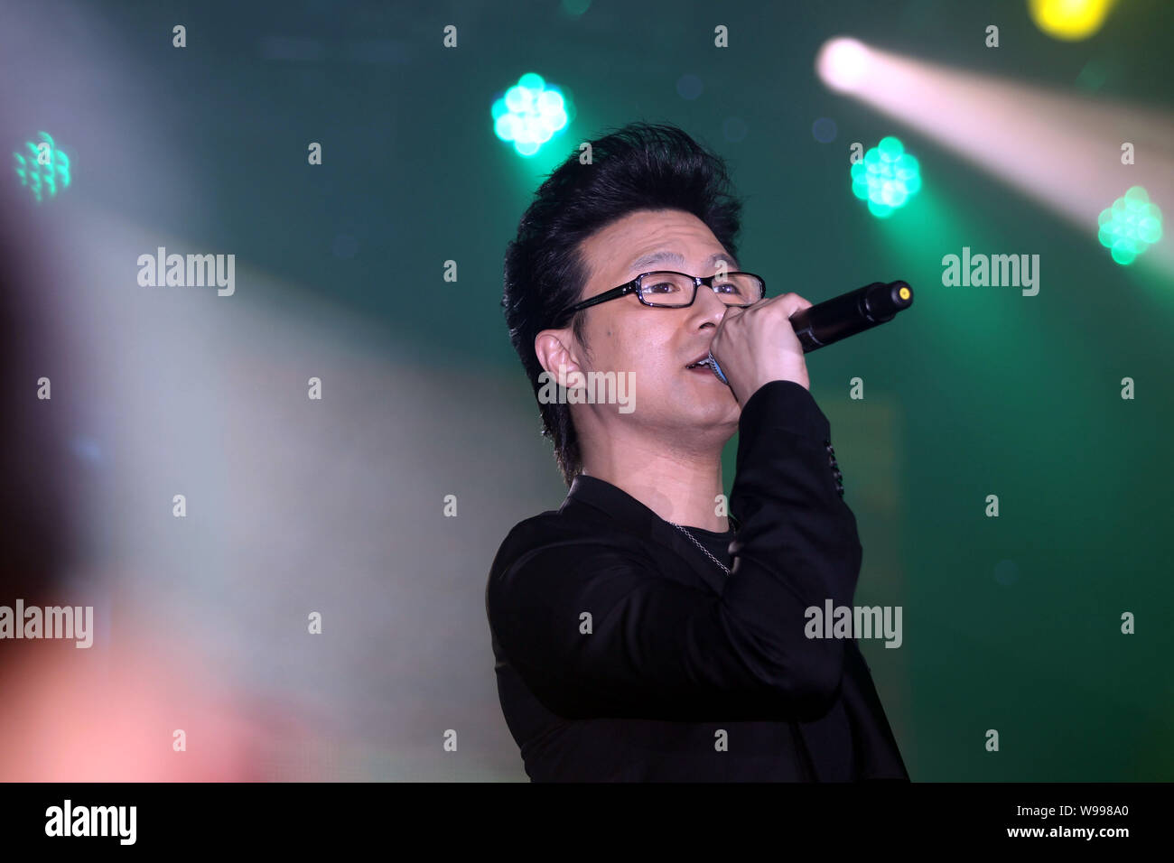 Chinese singer Wang Feng performs at an award ceremony by Chinese ...