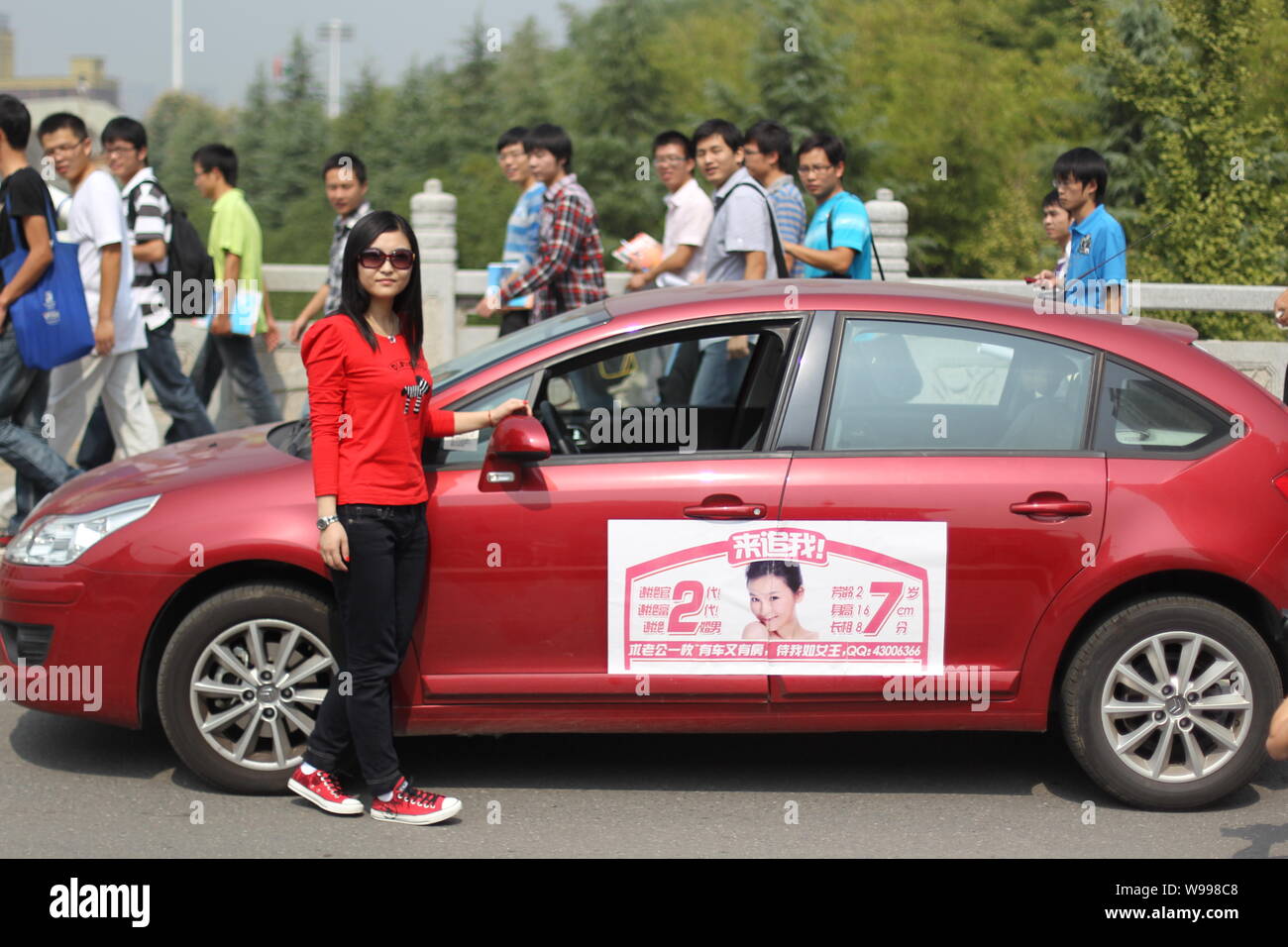The woman whose Citroen is bedecked with notices with the words husband ...