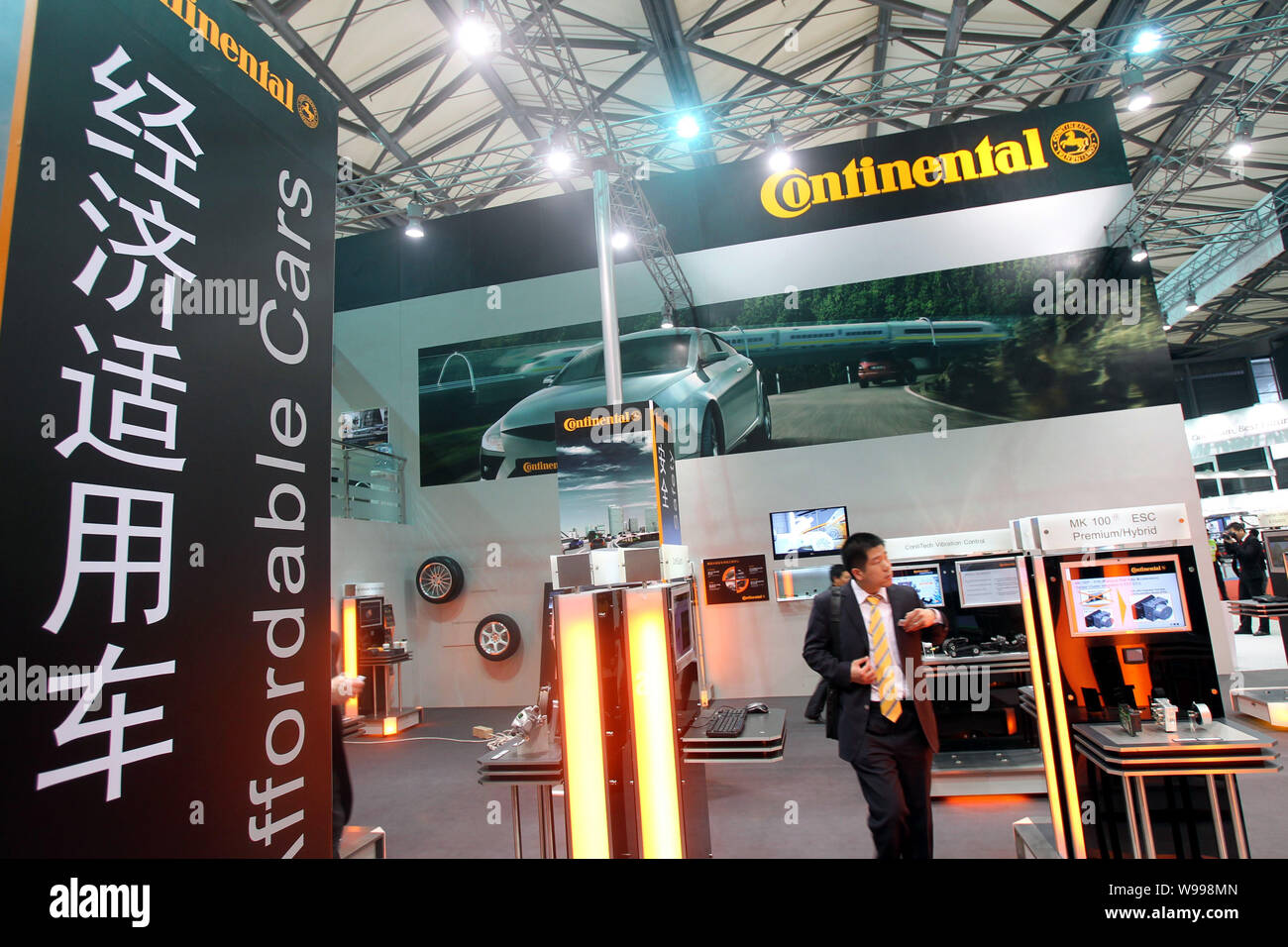 --FILE--Visitors walk through the stand of Continental at the 14th ...