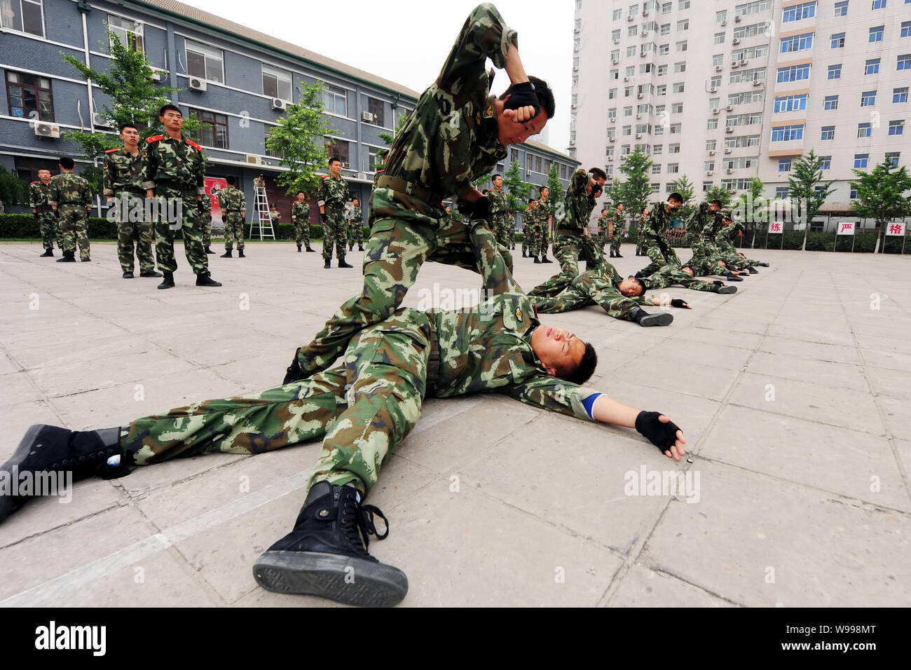 Chinese paramilitary policemen practice fighting skills during a drill ...