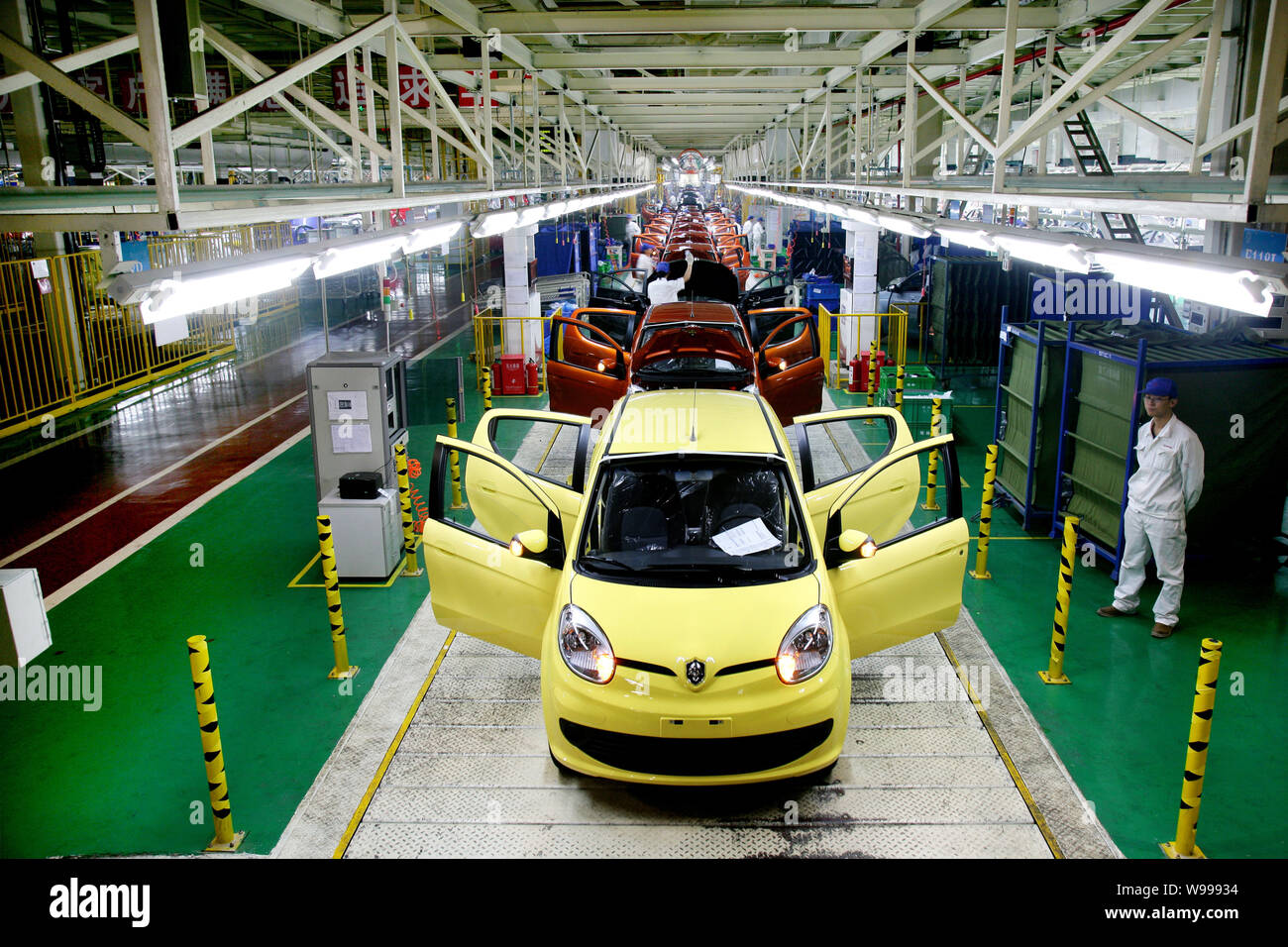 --FILE--Chana cars pass through the assembly line at the auto plant of ...