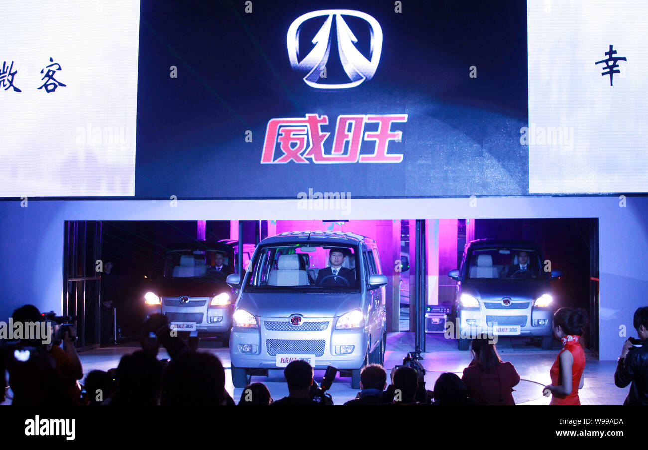 The BAIC Weiwang 306 minivans are pictured during a launch ceremony in ...