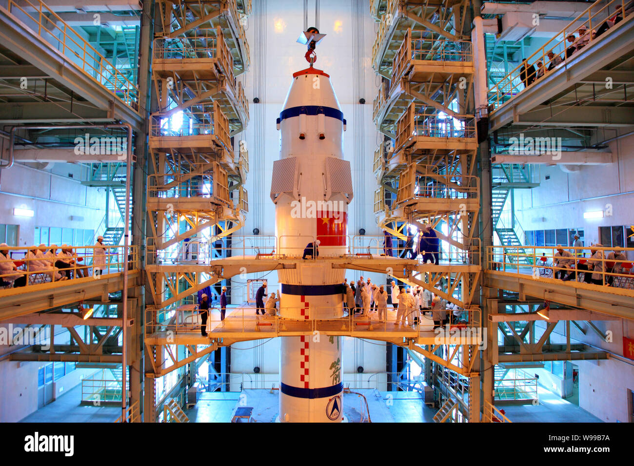 A Long March 2F (CZ-2F) carrier rocket is being assembled in the final ...
