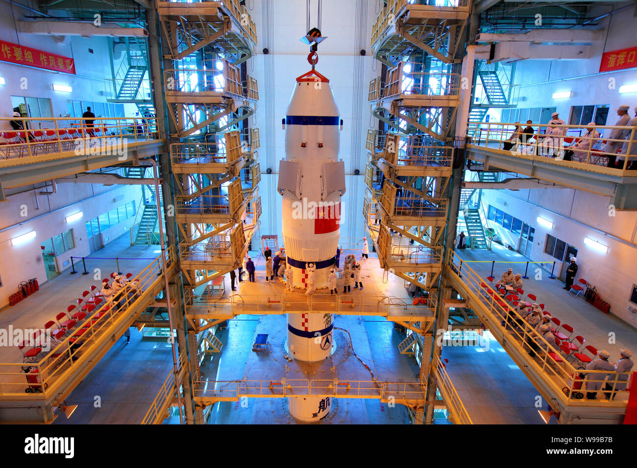 A Long March 2F (CZ-2F) carrier rocket is being assembled in the final ...
