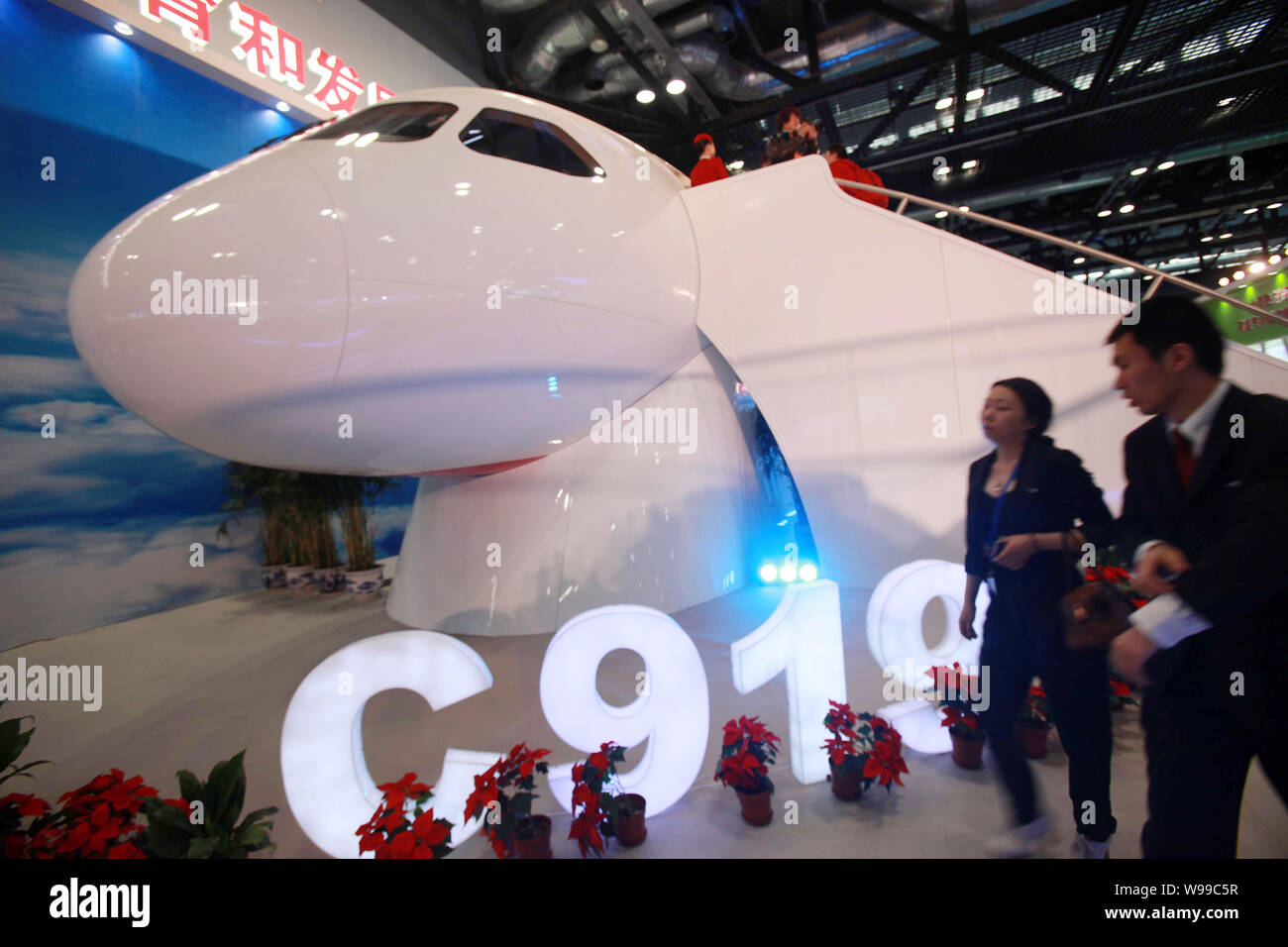 --File--Visitors look at a full scale model of the C919 jet plane of ...
