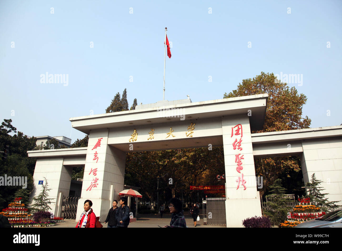 --FILE--Chinese students walk past an entrance of Nanjing University in ...
