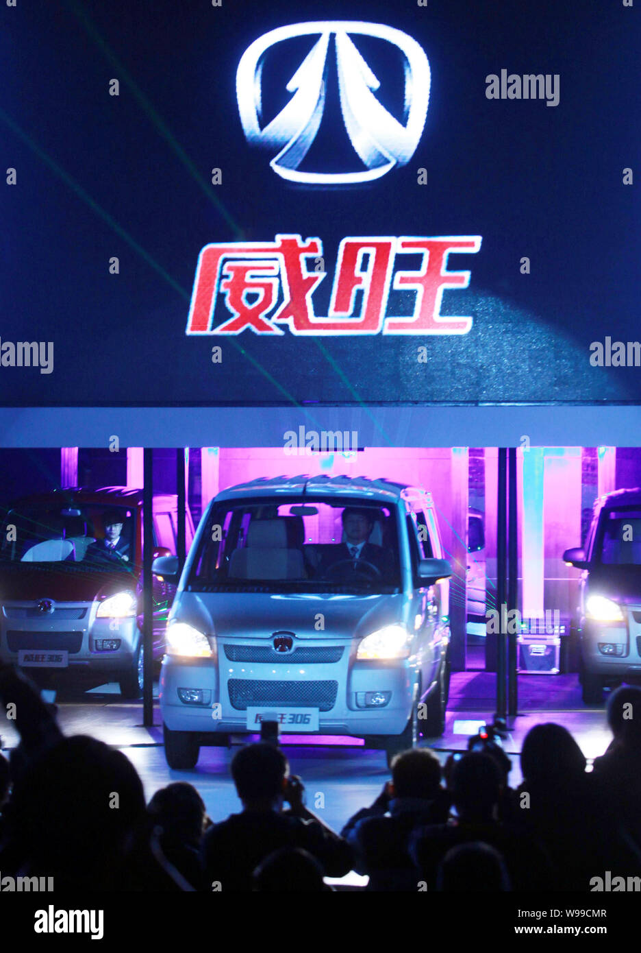 The BAIC Weiwang 306 minivans are pictured during a launch ceremony in ...