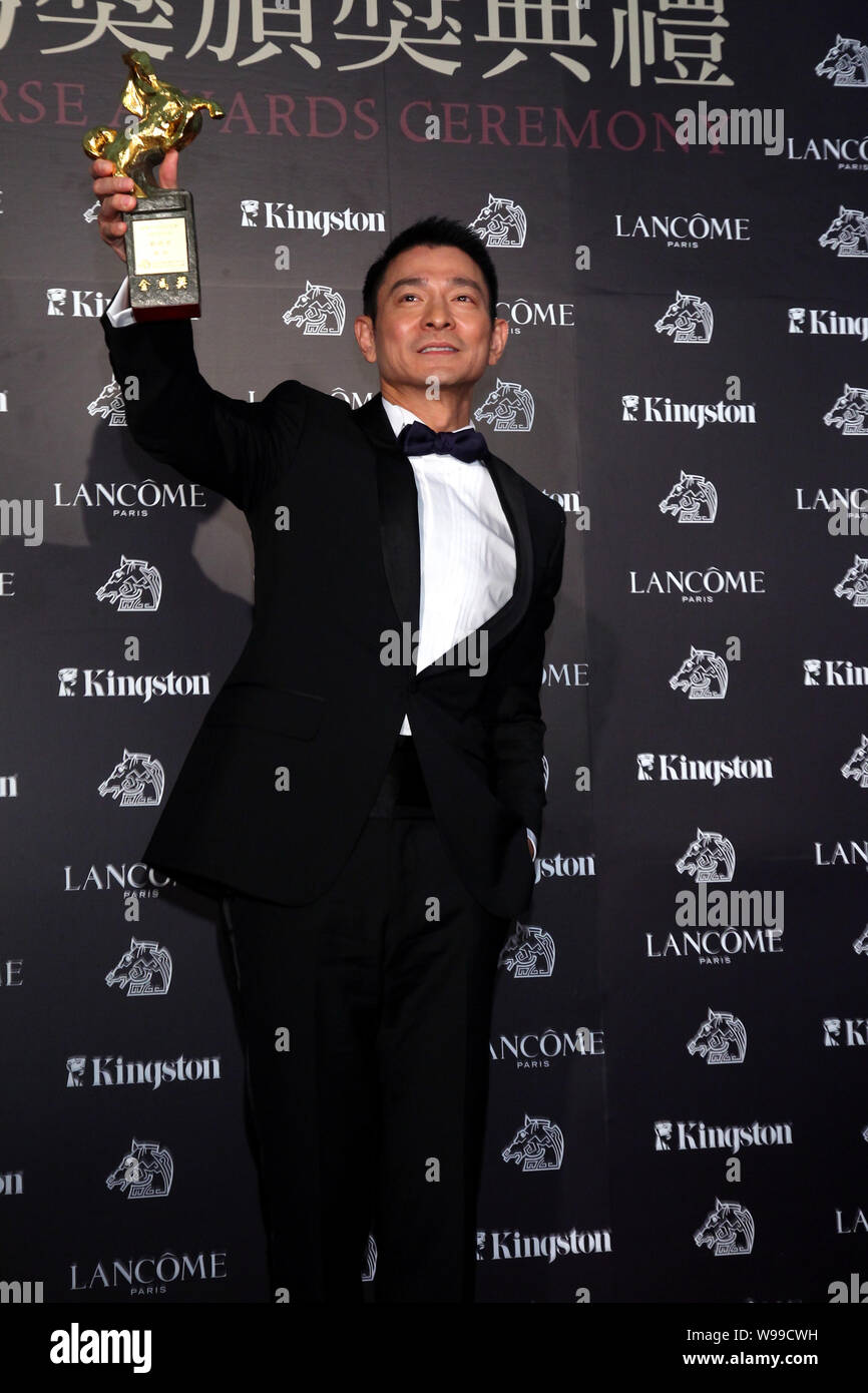 Hong Kong singer and actor Andy Lau holds his trophy for the Best Actor ...