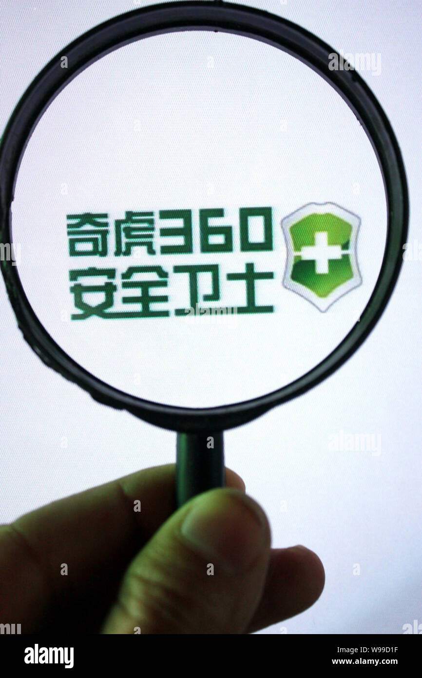 --FILE--A user looks through a magnifying glass at the logo of the 360 ... --FILE--A user looks through a magnifying glass at the logo of the 360 ...