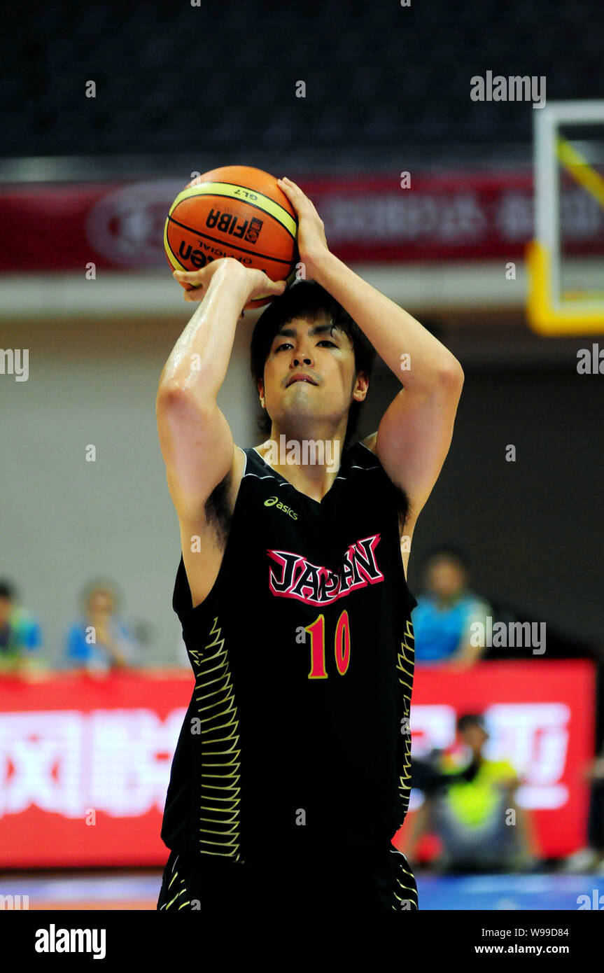 Kosuke Takeuchi of Japan plays a shot against South Korea during their ...