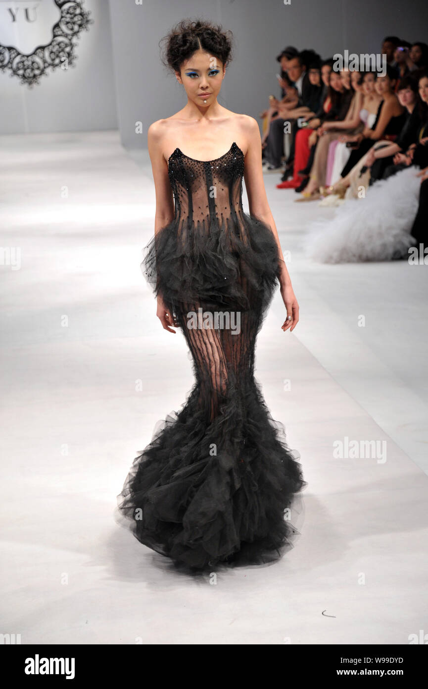 A model parades to show the new collection during the Lanyu 2012 ...