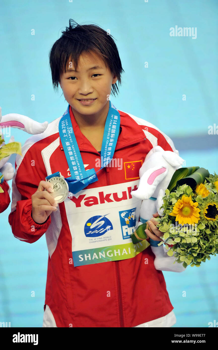 Chinas silver medalist Hu Yadan poses on the podium at the award ...