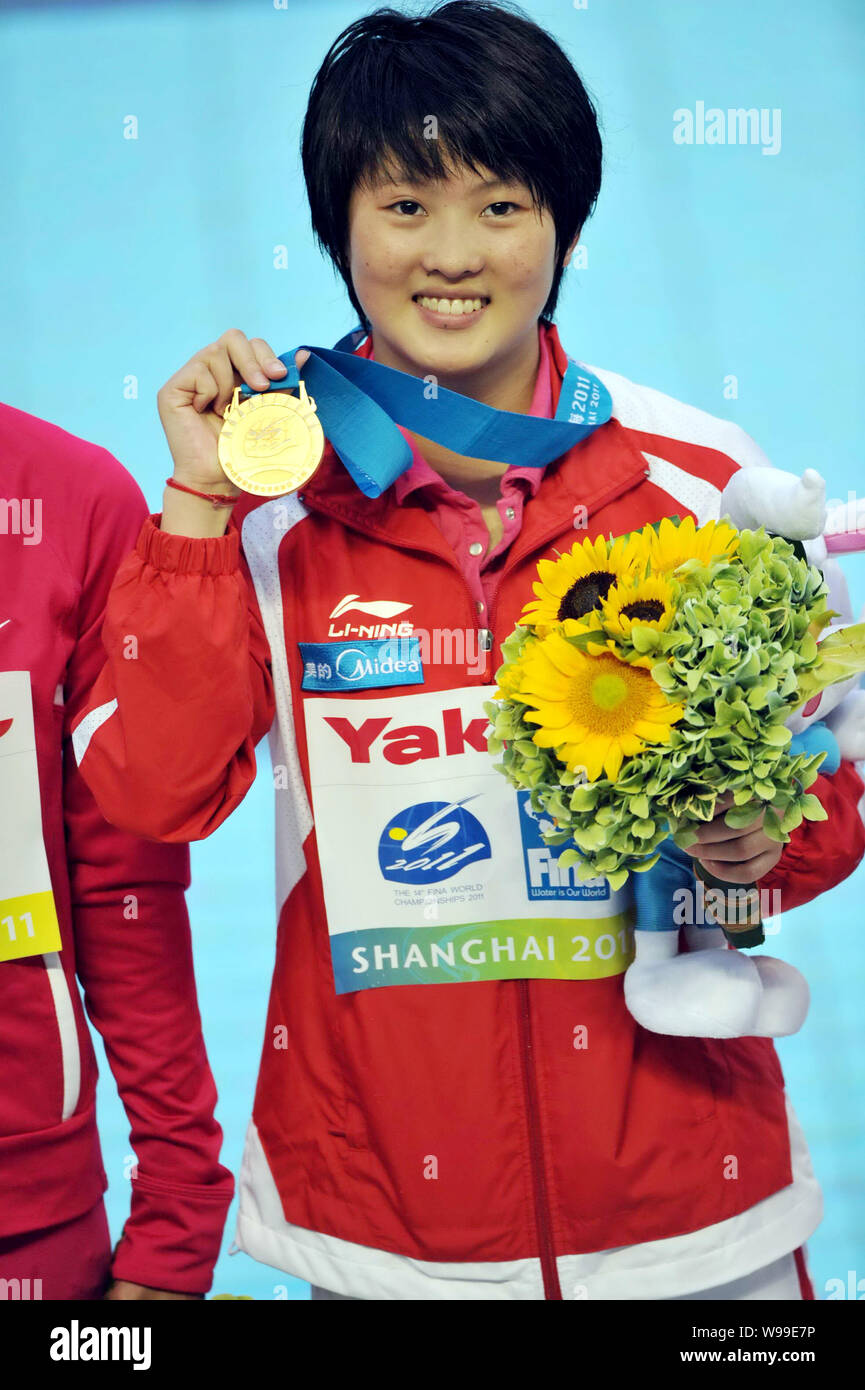 Chinas gold medalist Chen Ruolin poses on the podium at the award ...