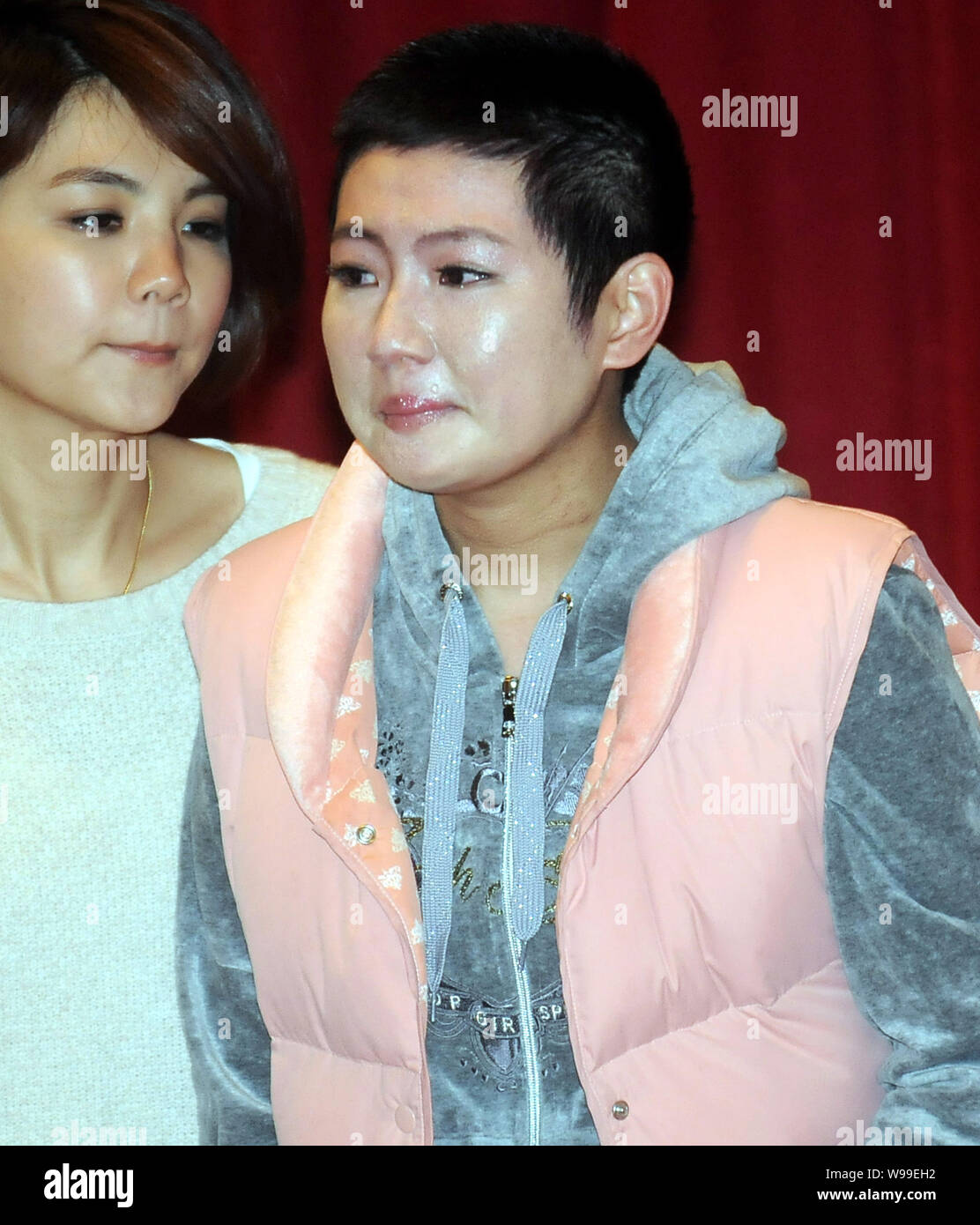 Selina Jen (or Selina Ren), right, weeps next to Ella Chen of Taiwanese girl pop group S.H.E ...