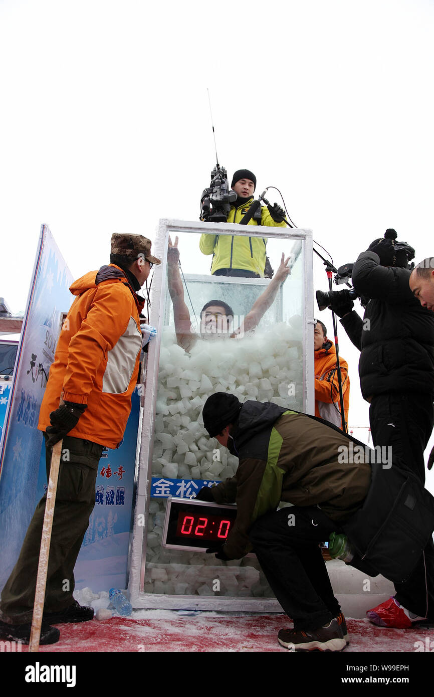 Chinese Iceman Jin Songhao celebrates in his box filled with ice cubes ...