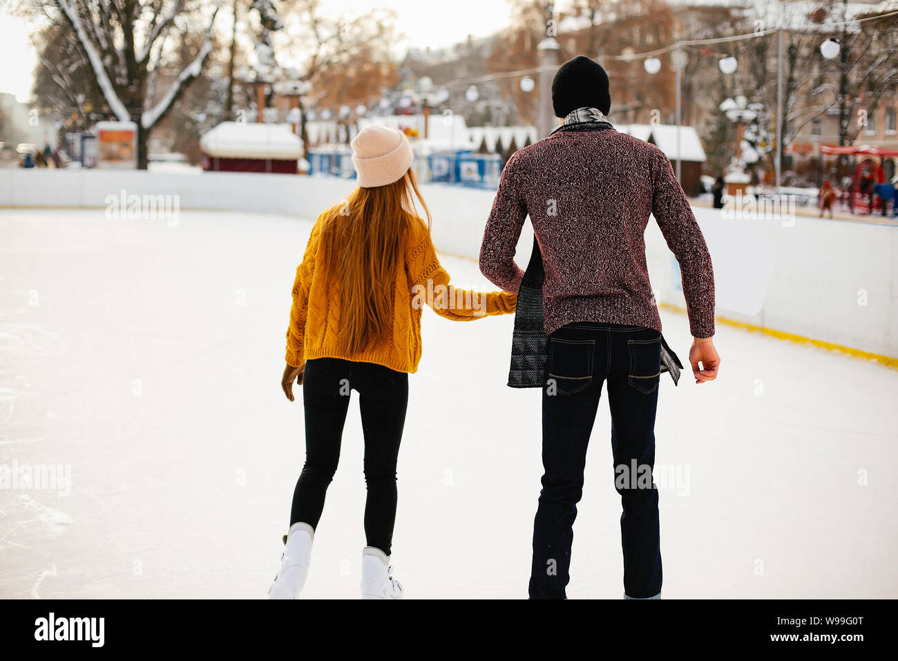 Cute couple in a ice arena Stock Photo - Alamy