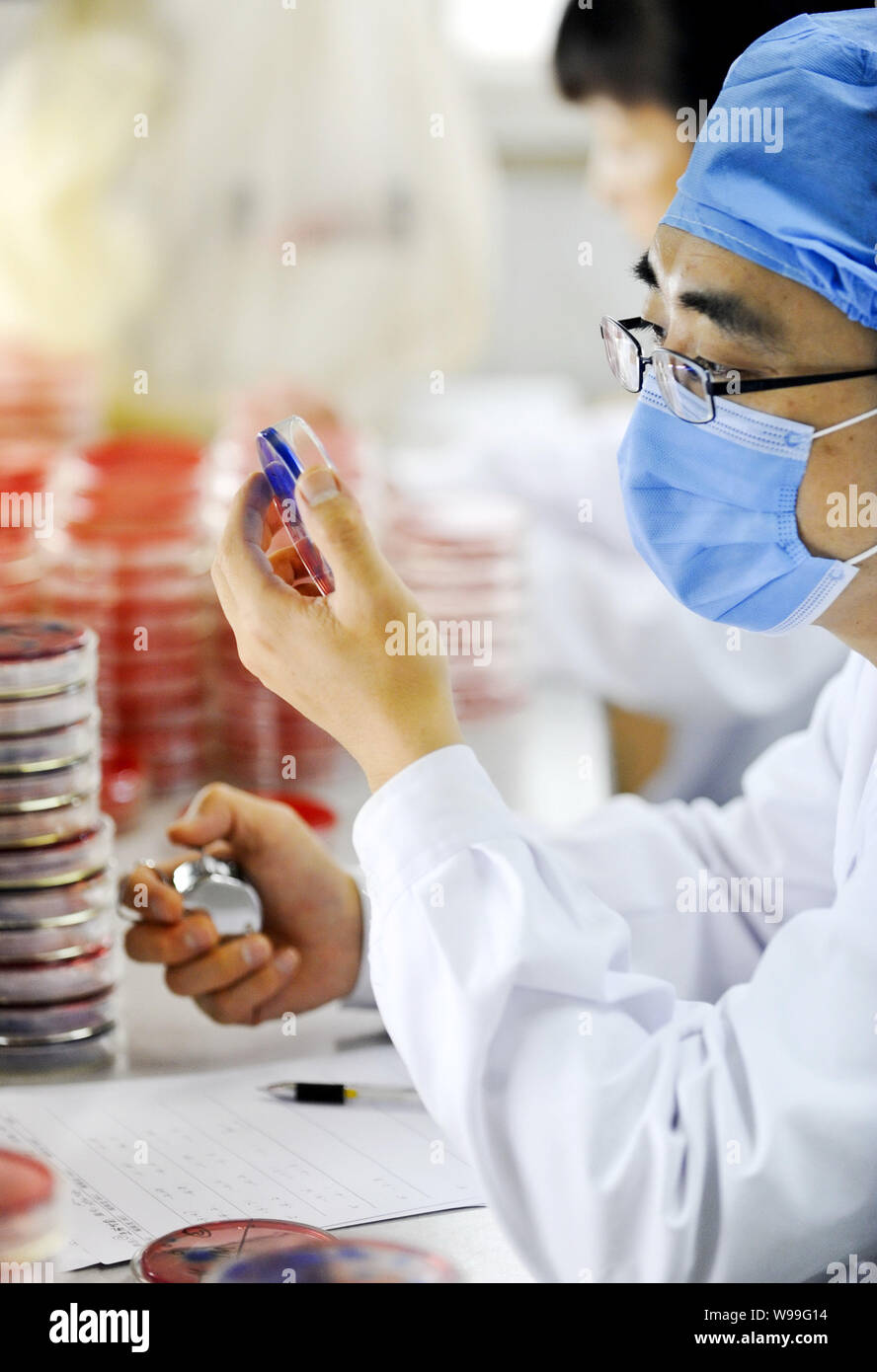 --FILE--A Chinese researcher checks the result of an experiment at a ...