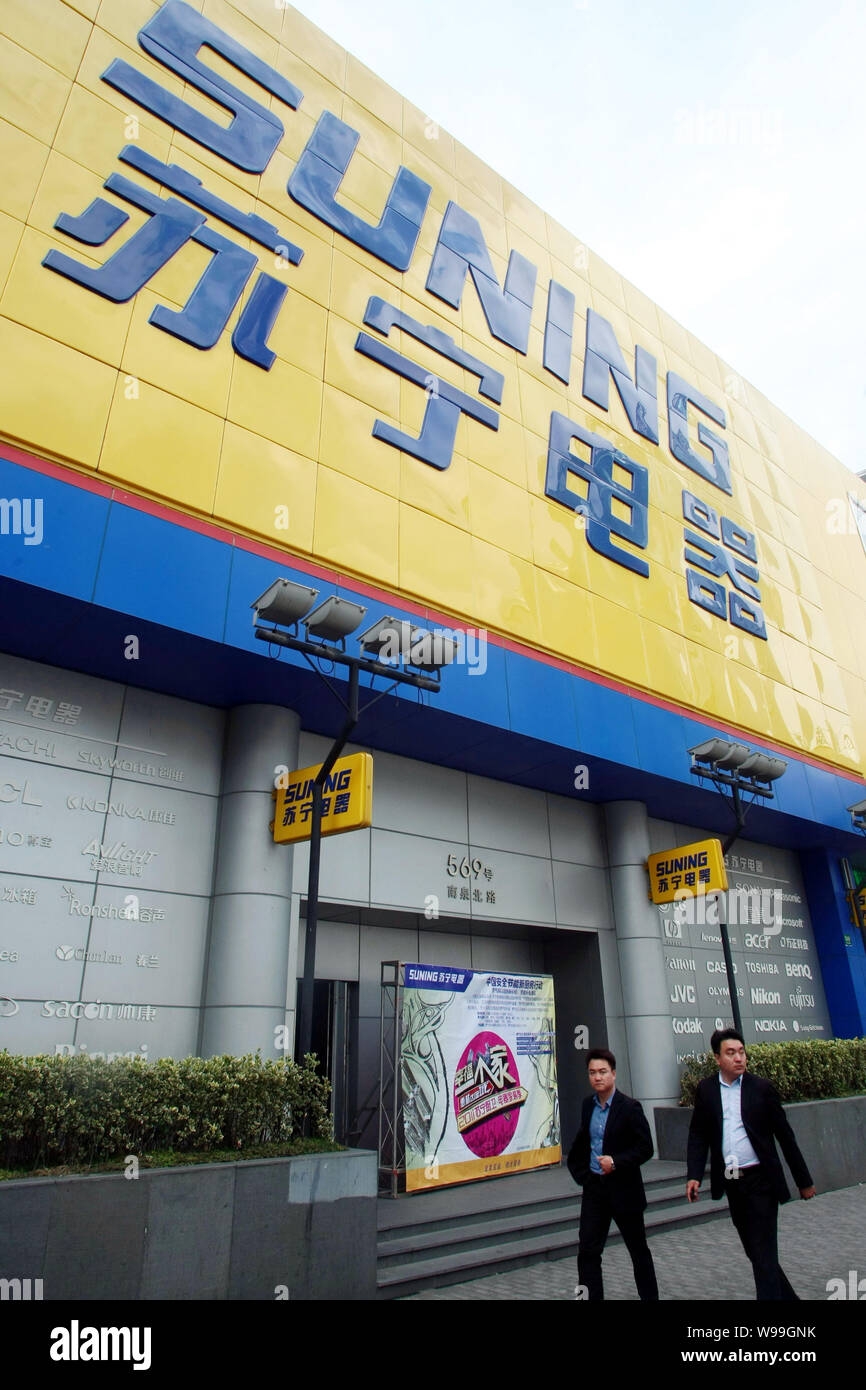 --FILE--Pedestrians walk past a Suning home appliances chain store in ...