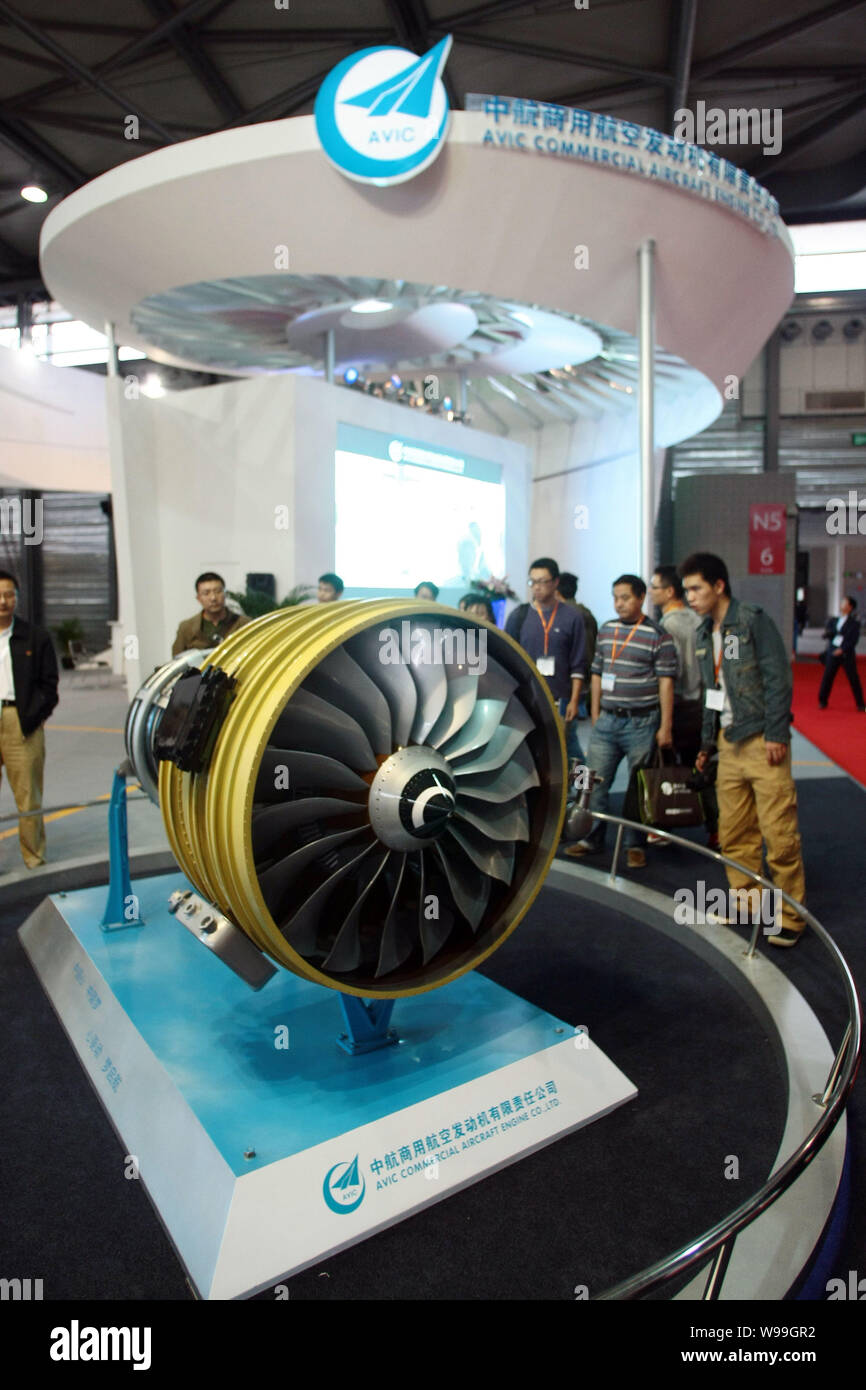 Visitors look at a turbofan engine to be used on Chinas first jumbo jet ...