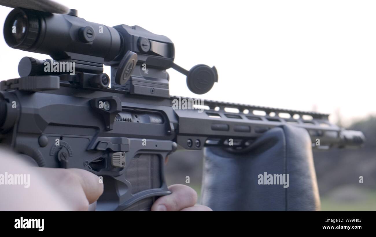 Shotgun In Man' S Hand. Front Side Of Weapon With Close Up View On ...