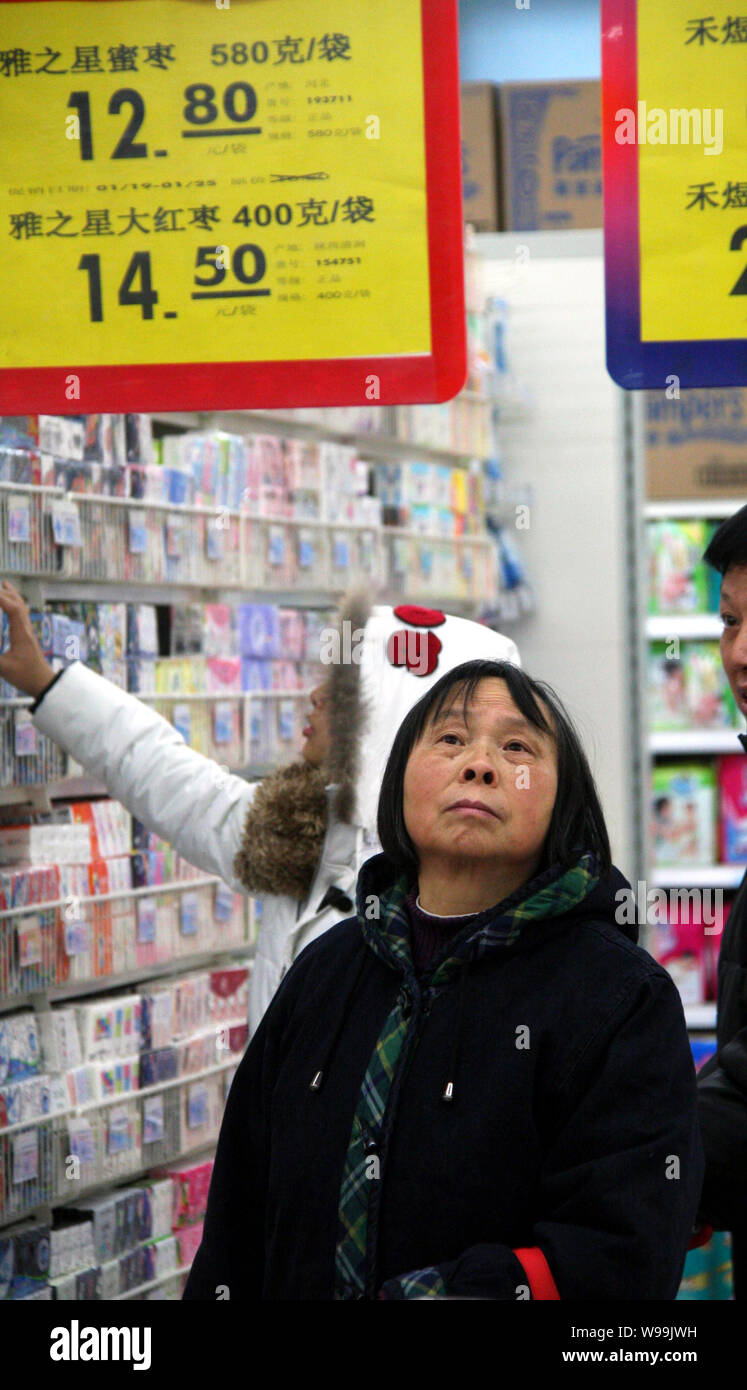 Chinese consumers are seen shopping at a supermarket in Nantong city ...