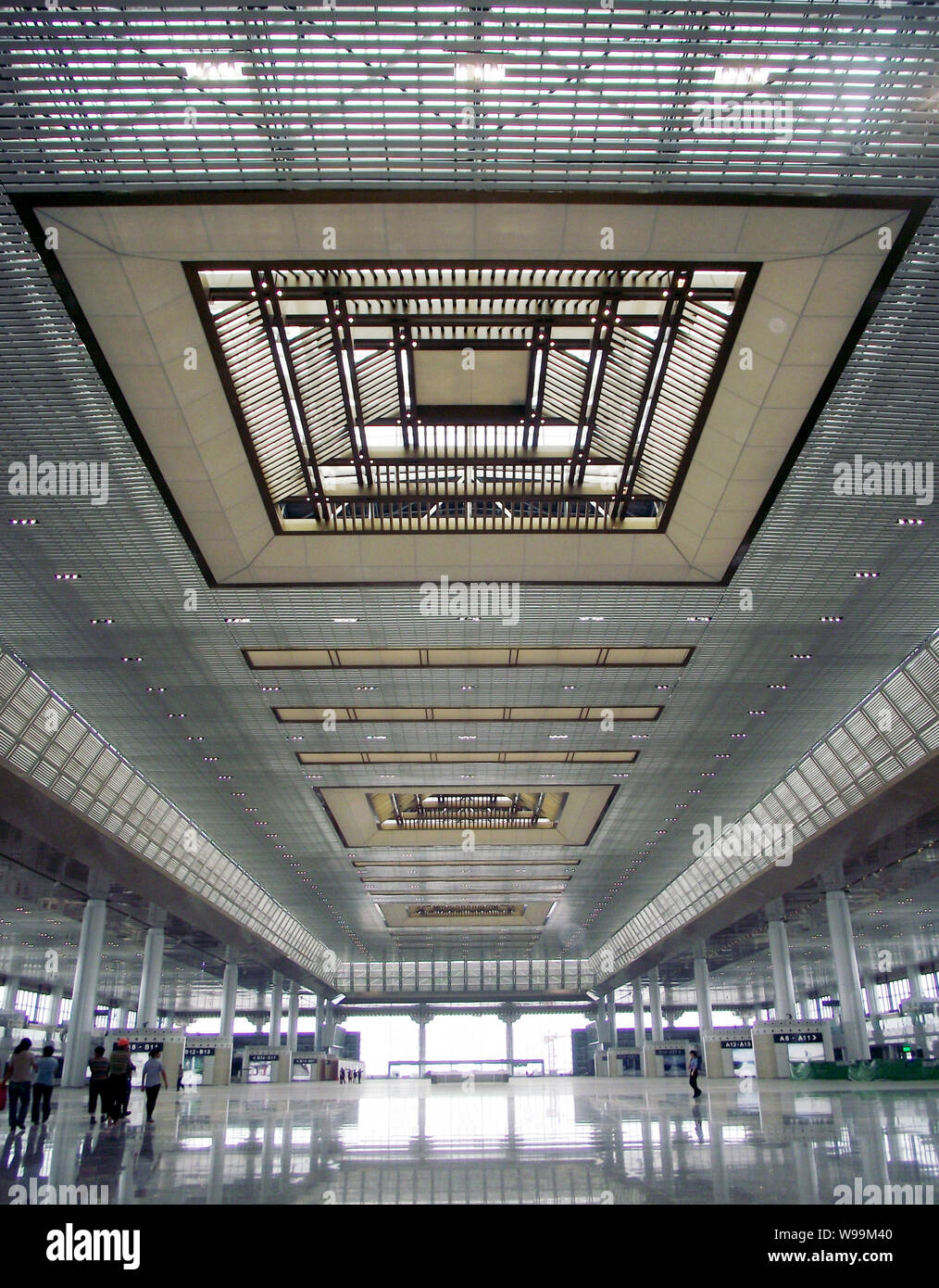 People visit the Nanjing South Railway Station, part of the Beijing ...