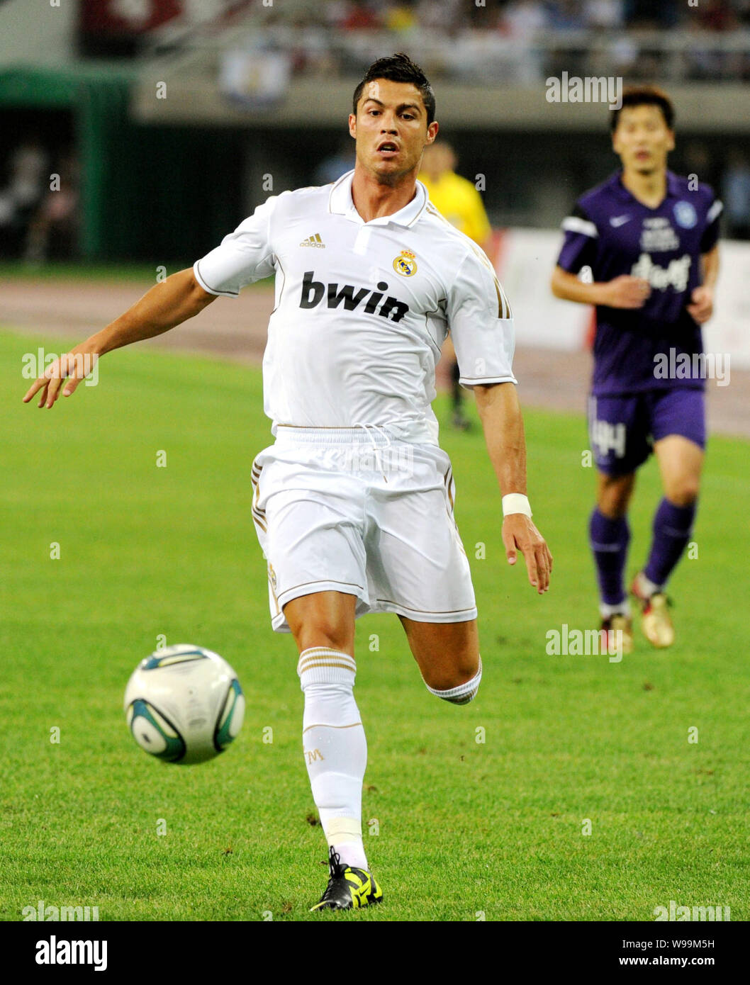 Cristiano Ronaldo of Real Madrid dribbles against Tianjin Teda during a ...
