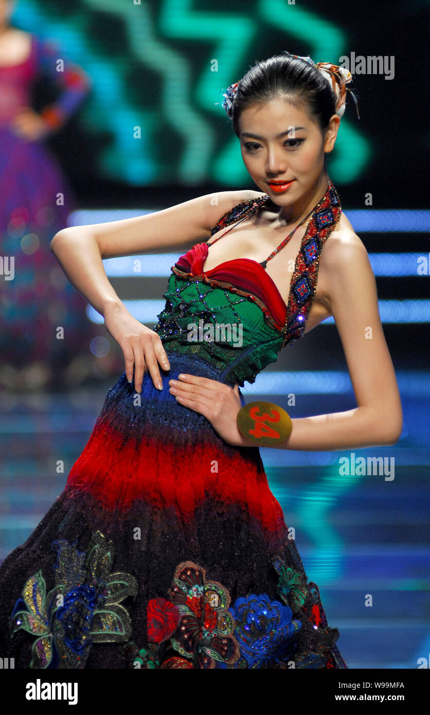 A model wearing garment with Chinese elements pose on the stage during ...