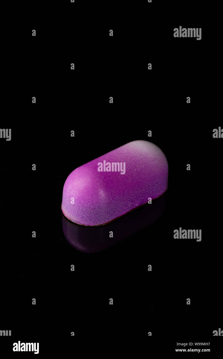Chocolate candy on black background Stock Photo - Alamy