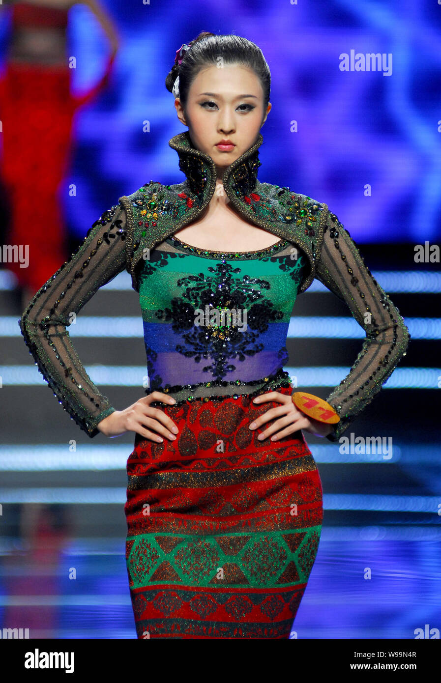 A model wearing garment with Chinese elements pose on the stage during ...