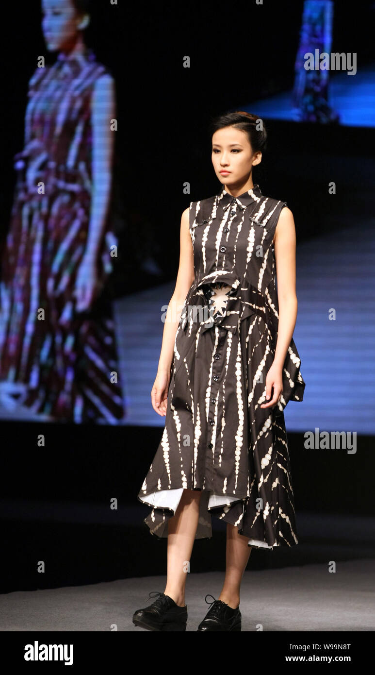 A model parades to show the new creation in the Taipei IN Style fashion ...