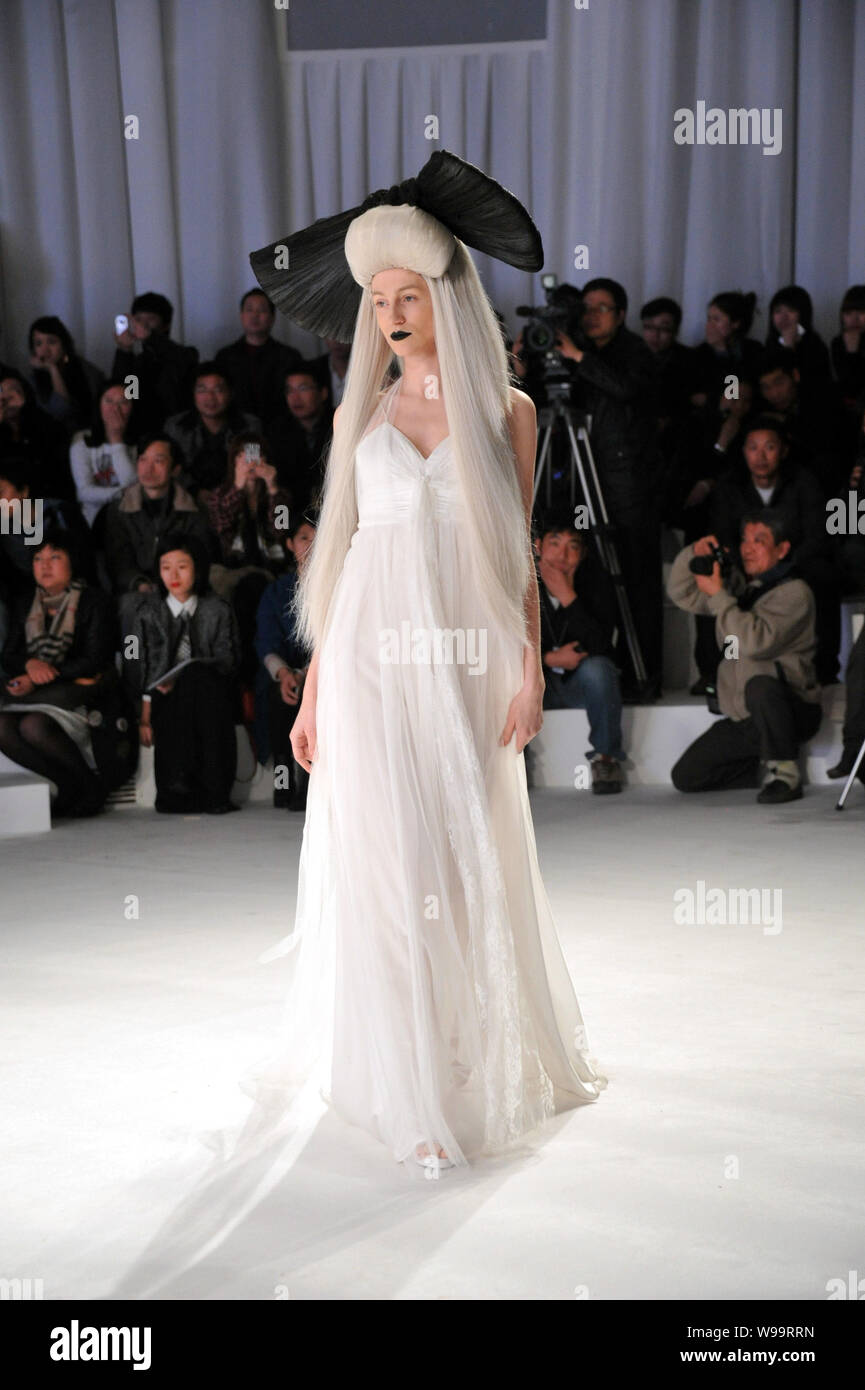 A model parades to show a new wig during the Rebecca 2011 Autumn/Winter ...