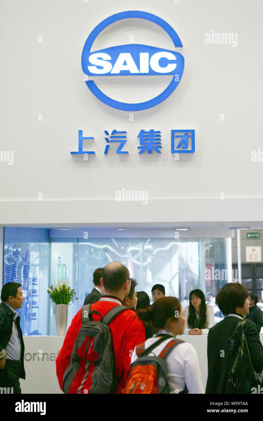 --FILE--Visitors walk past the booth of SAIC (Shanghai Automotive ...