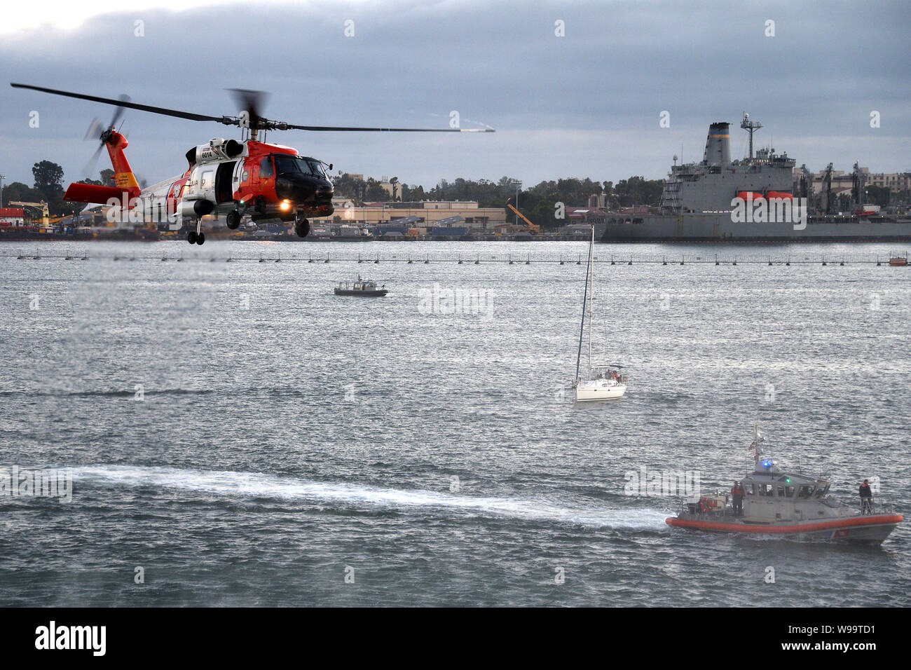 A Coast Guard Sector San Diego MH-60T Jayhawk helicopter crew and a ...