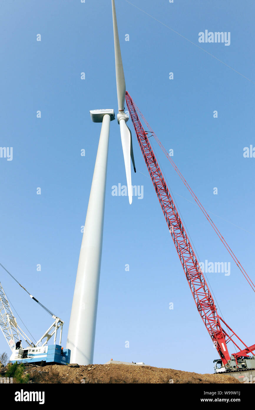 --FILE--Chinese workers install a wind turbine at a wind farm in ...