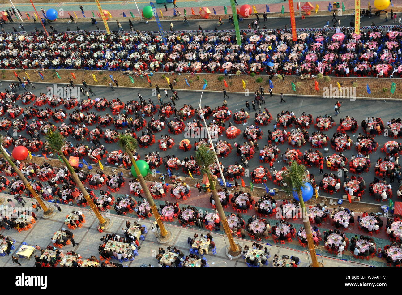 Local Chinese residents set up more than 1,500 tables in a collective ...