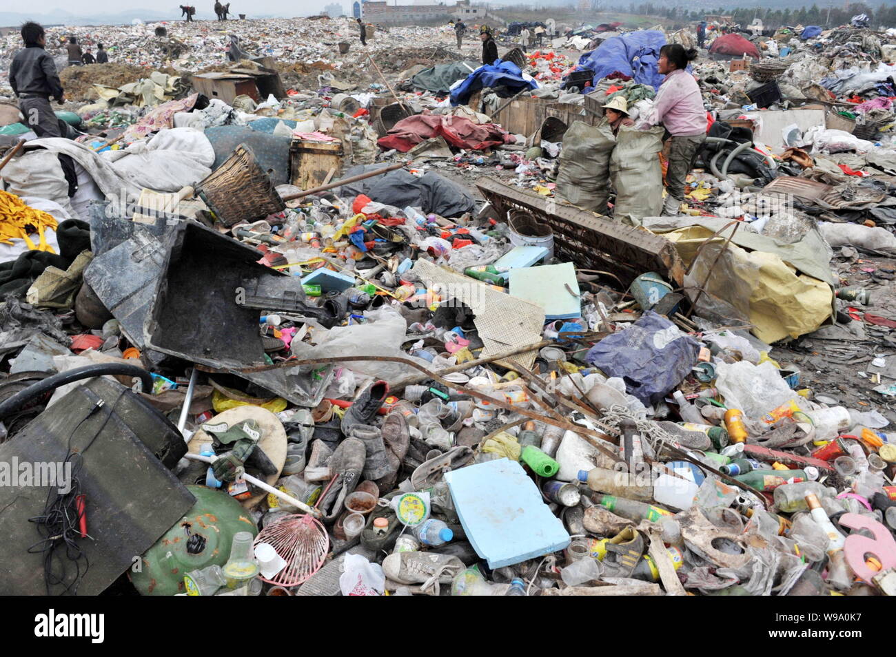 --FILE--Chinese junkmen search garbage for useful products at a ...
