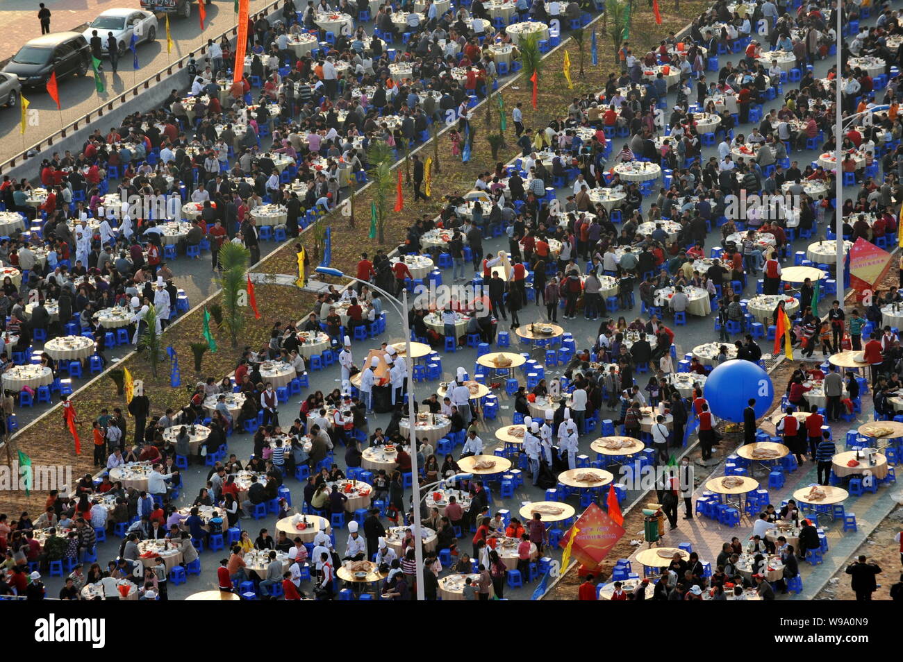 Local Chinese residents set up more than 1,500 tables in a collective ...