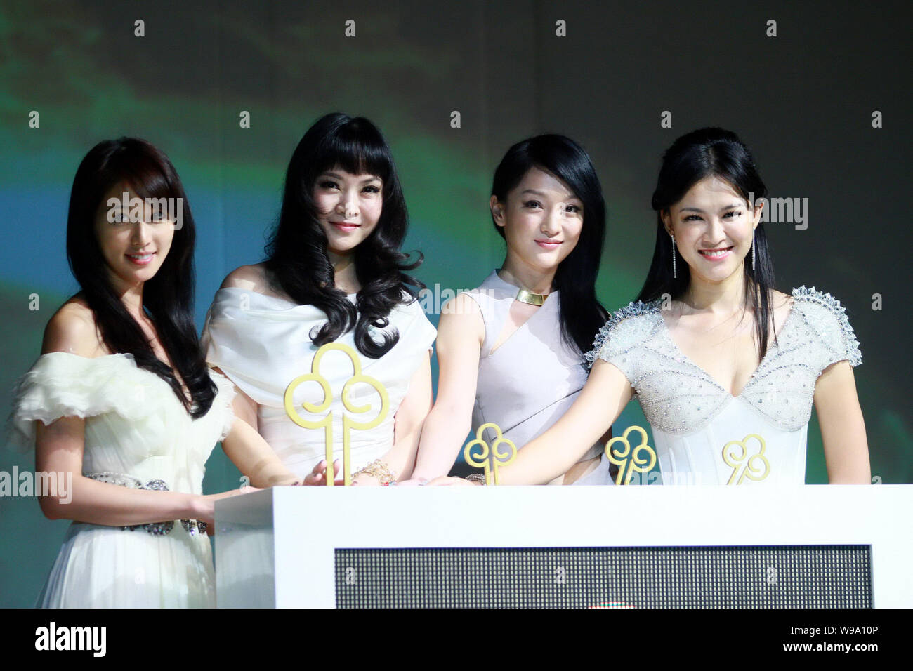 Taiwanese model and actress Lin Chi-ling, left, and Chinese actress Zhou Xun, second right, are ...