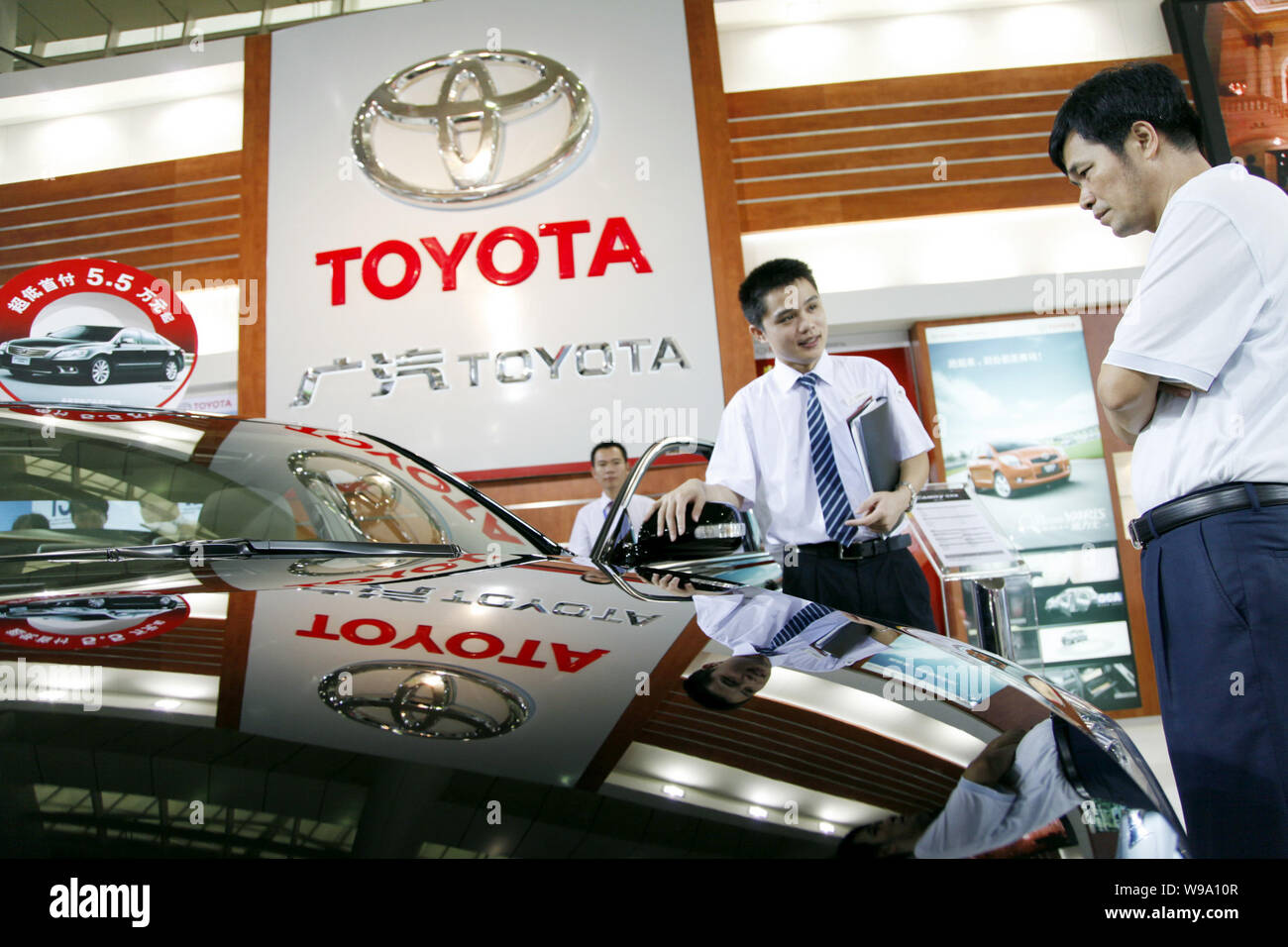 --FILE--A Chinese salesman introduces a Toyota car to a buyer during an ...