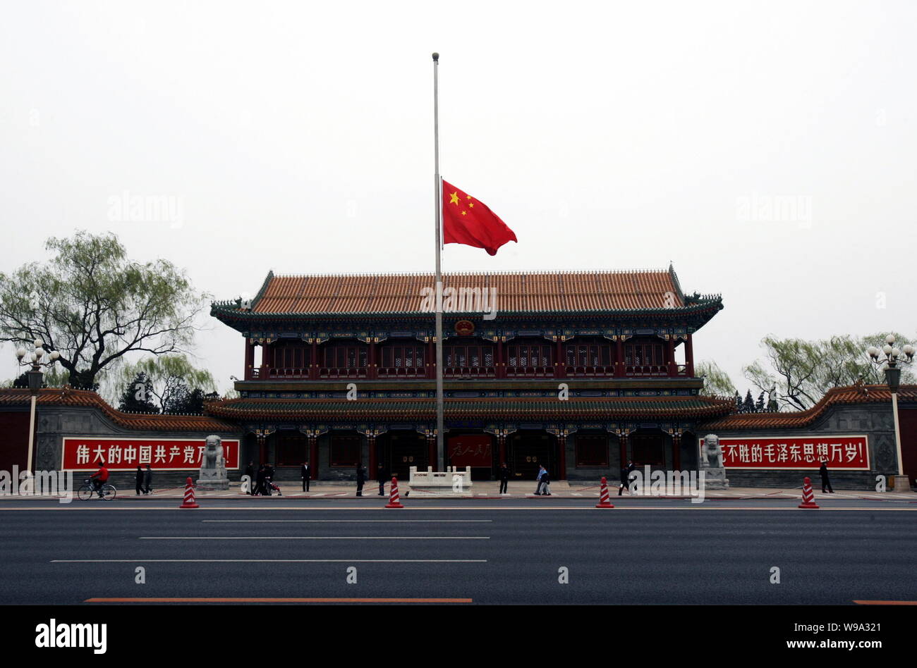 The Chinese flag fluttering at half-mast is seen in front of the Xinhua ...