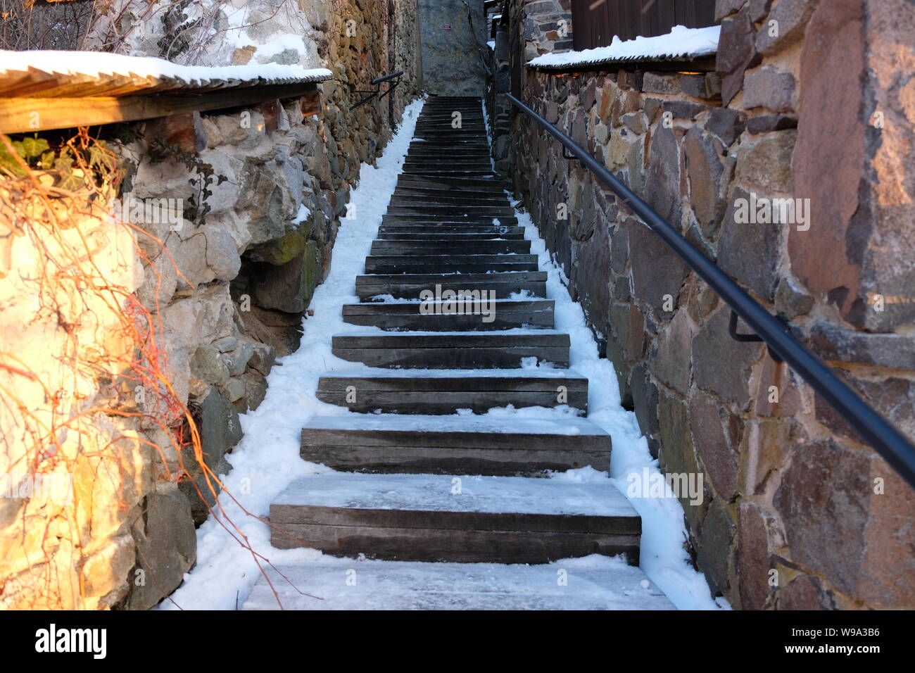 Old wooden stairs with stone walls in winter Stock Photo - Alamy