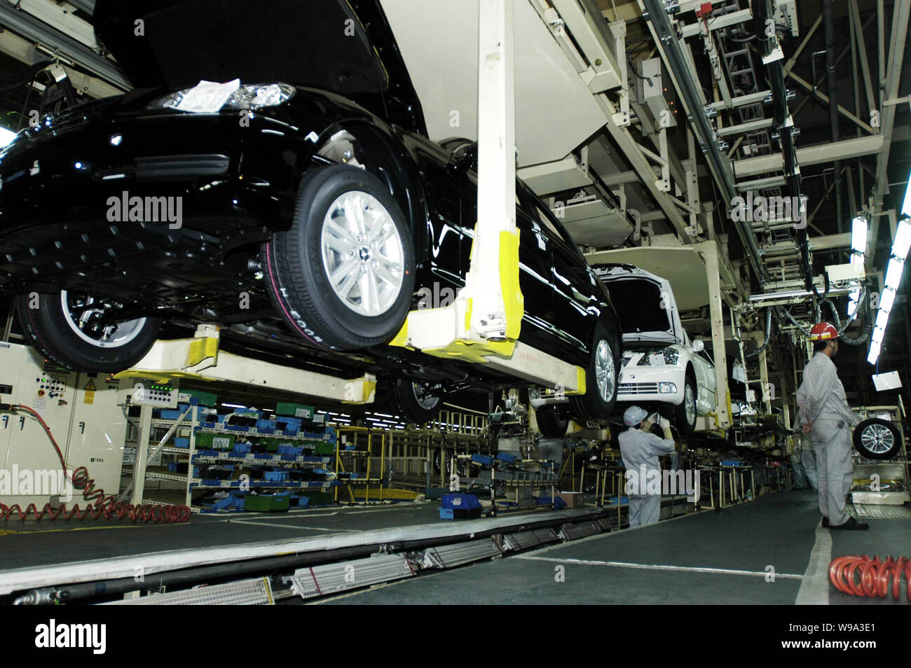 --FILE--Chinese workers assemble Toyota cars on the assembly line in ...