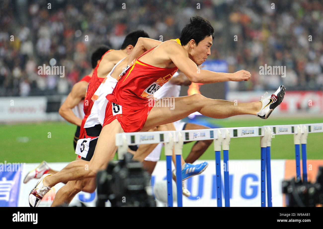 Chinas star hurdler Liu Xiang (front) competes in the mens 110 metres ...