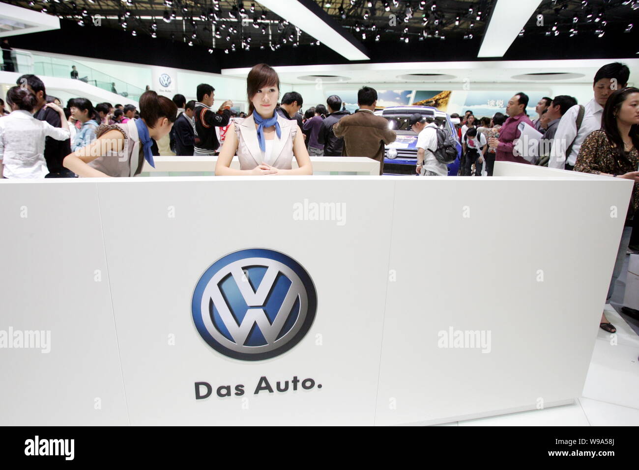--FILE--Visitors look at Volkswagen cars at the 13th Shanghai ...