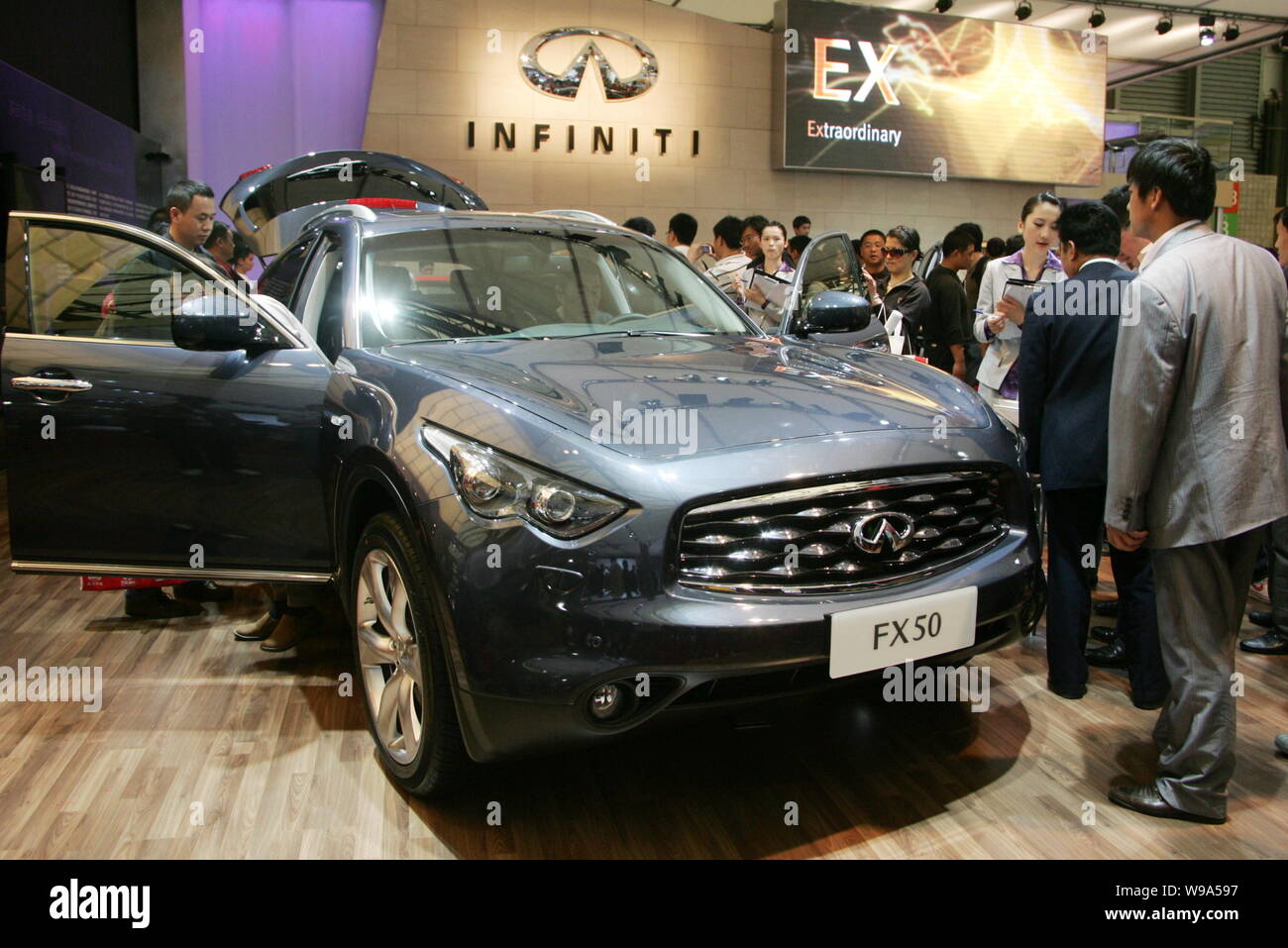 --FILE--Visitor look at a Nissan Infiniti M35 on display at the 13th ...