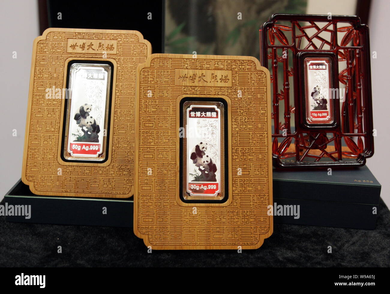 Panda-themed silver bars for the World Expo 2010 are seen during a ...